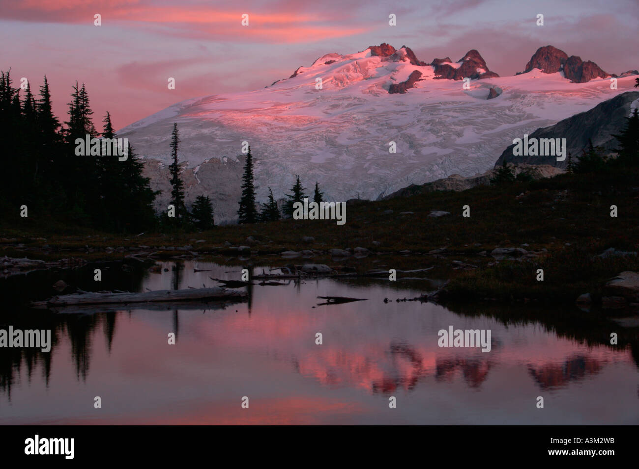 Evening light on Mt Challenger and the Challenger Glacier reflected in ...