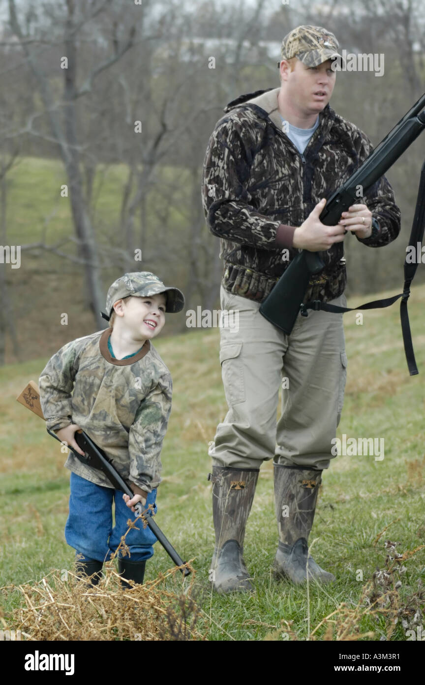 Father with his young son on his first hunt Stock Photo - Alamy