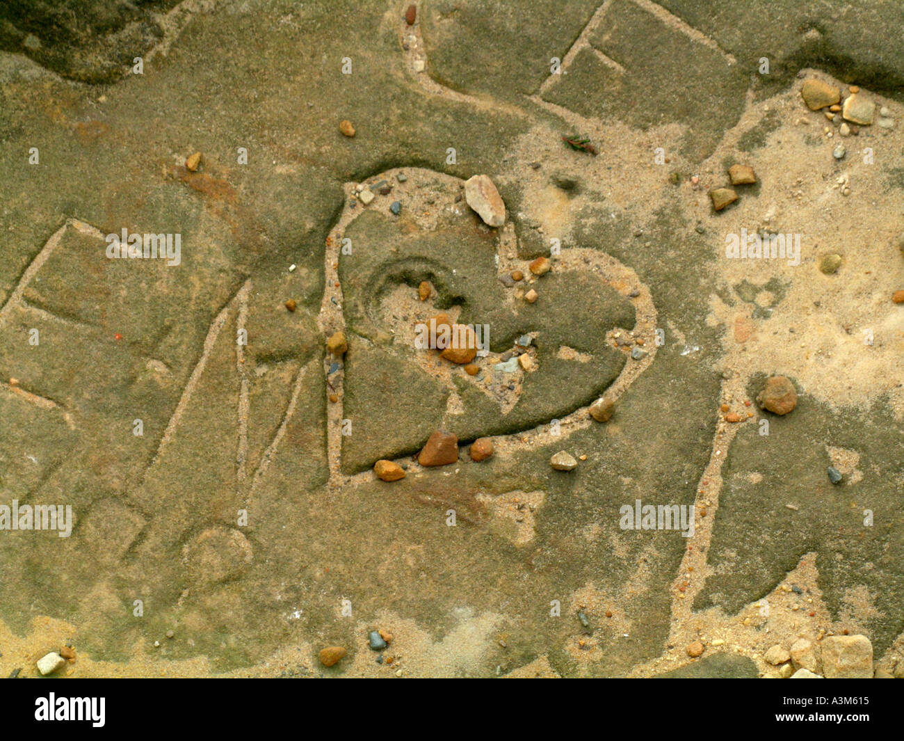 heart engraved in a stone Stock Photo - Alamy
