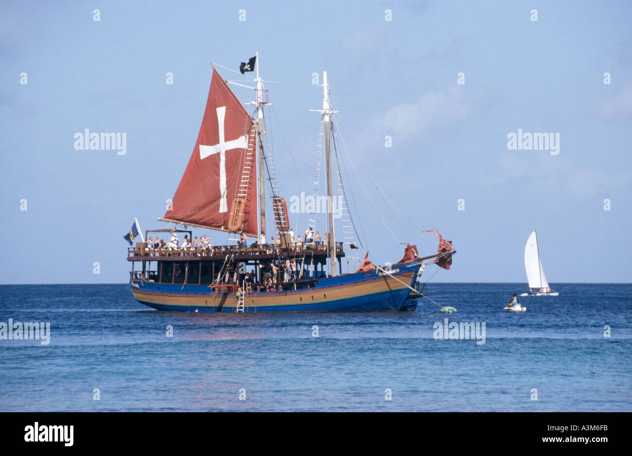 Jolly Roger Pirate sail boat with tourist people on lunch swimming ...