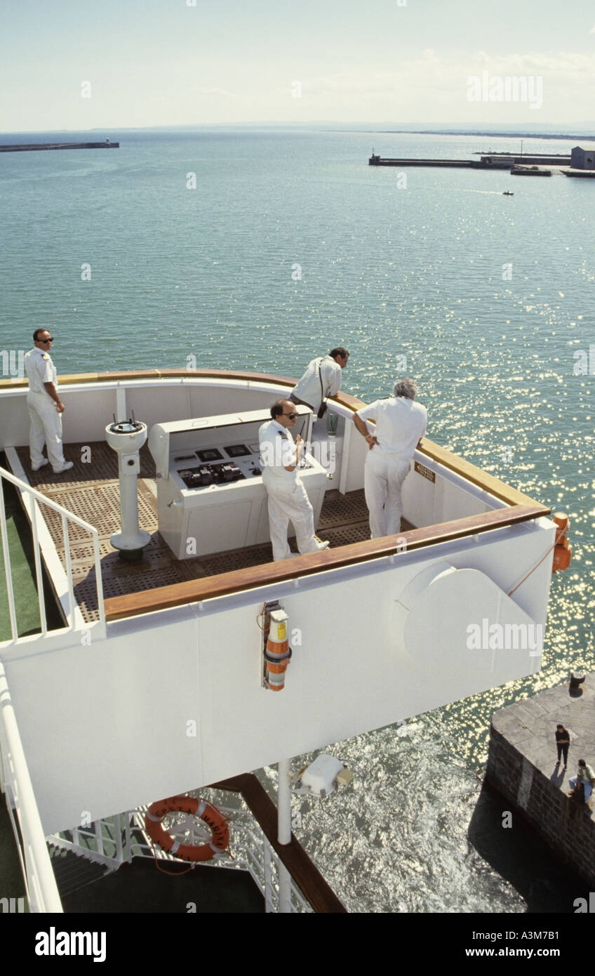 Ships Captain and Officers with local Pilot on wing bridge of cruise ...