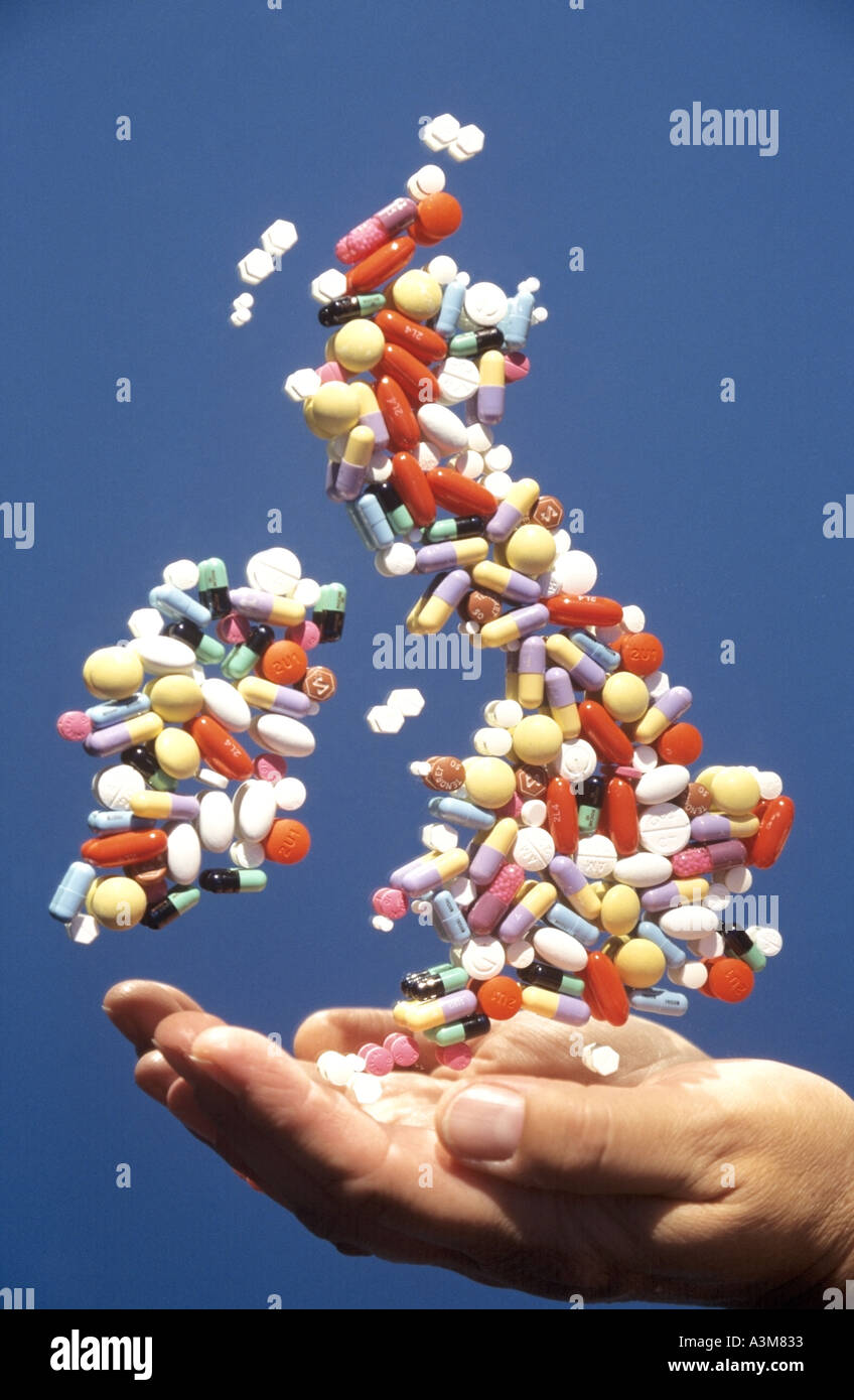 Still life conceptual mirror shot pills & tablets as a map held in hand ...