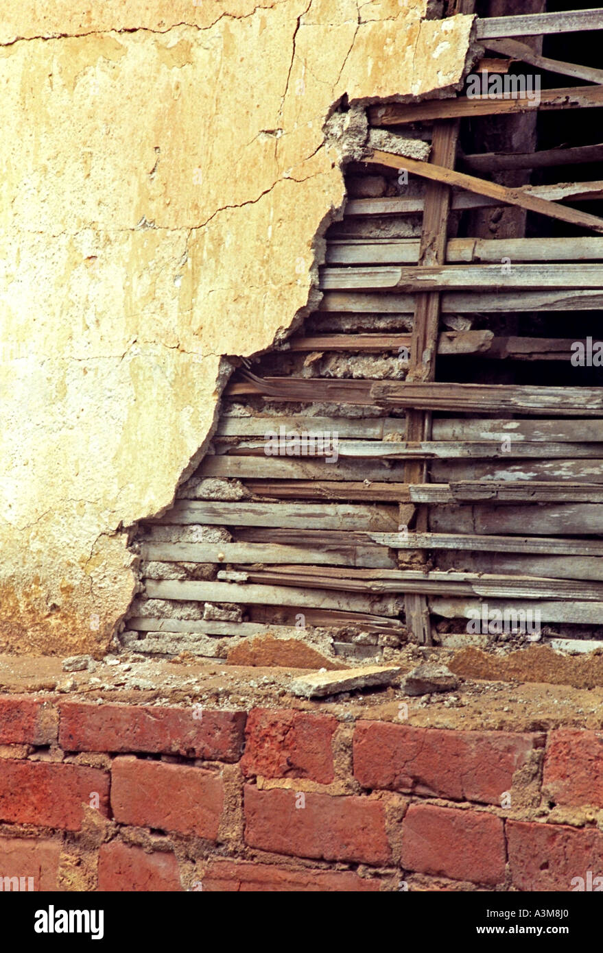 A damaged wall of bamboo slats plastered, in Luang Prabang, Laos. DM11 ...