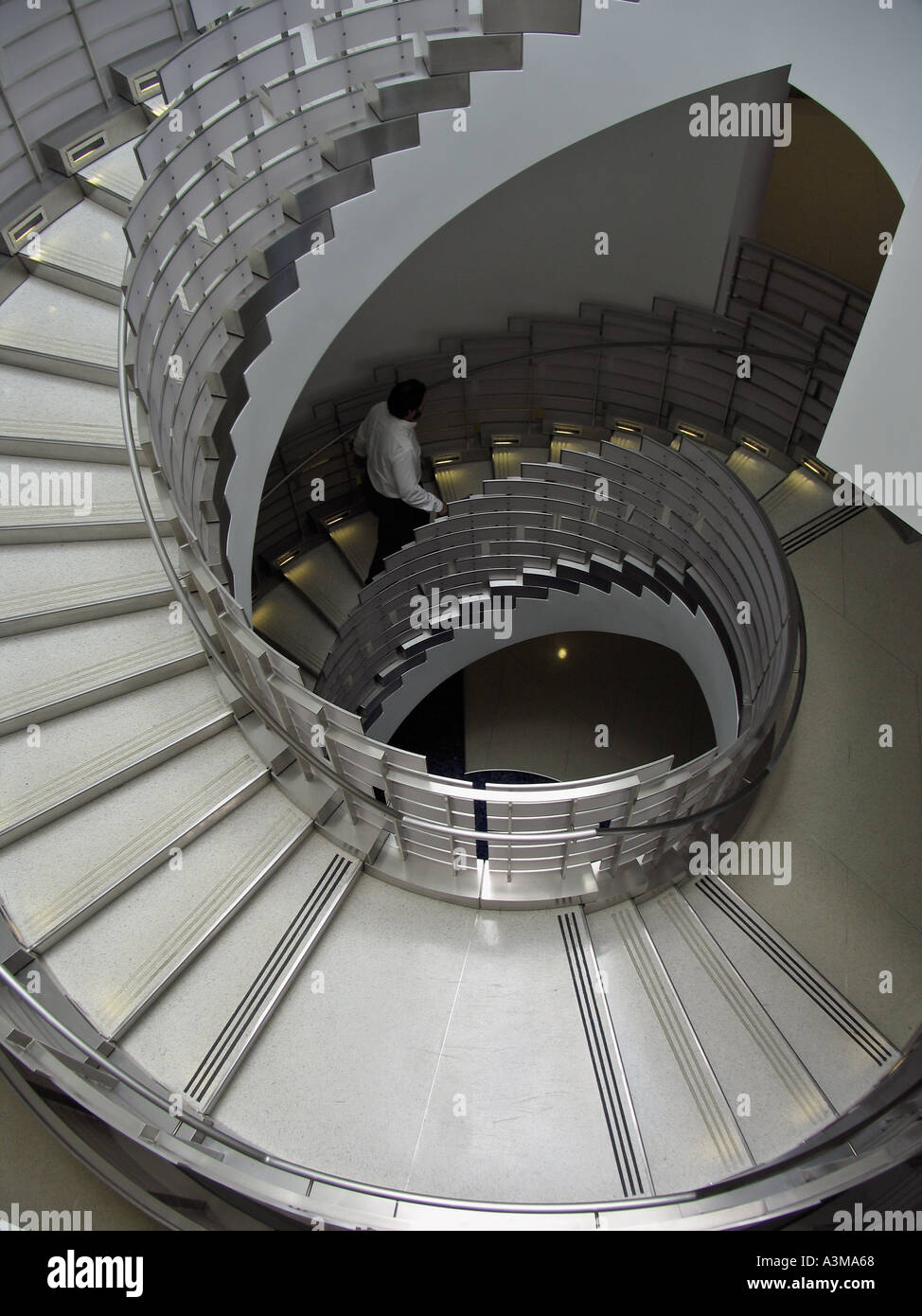Man walking down spiral staircase hi-res stock photography and images ...