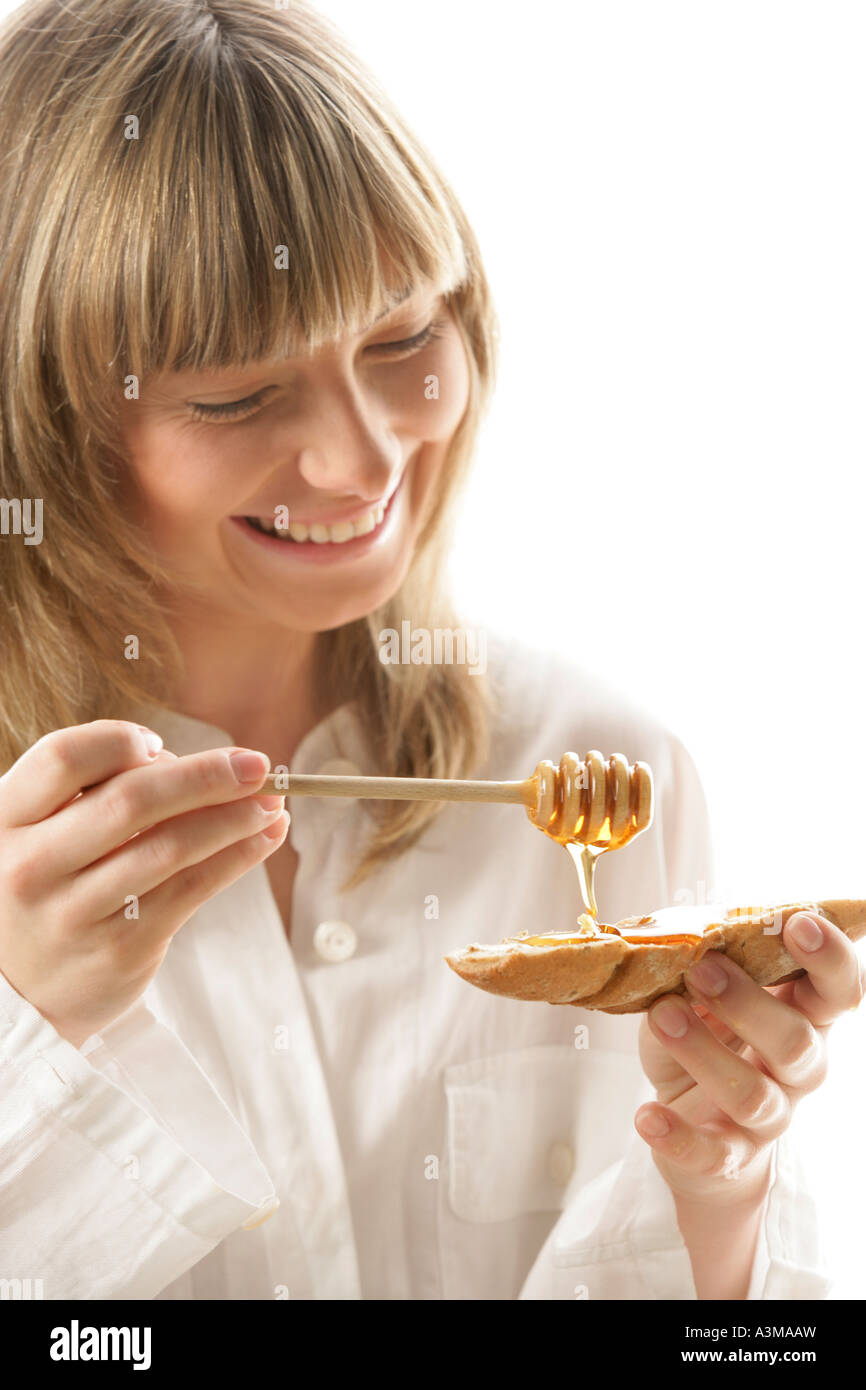 Young woman having breakfast Stock Photo - Alamy
