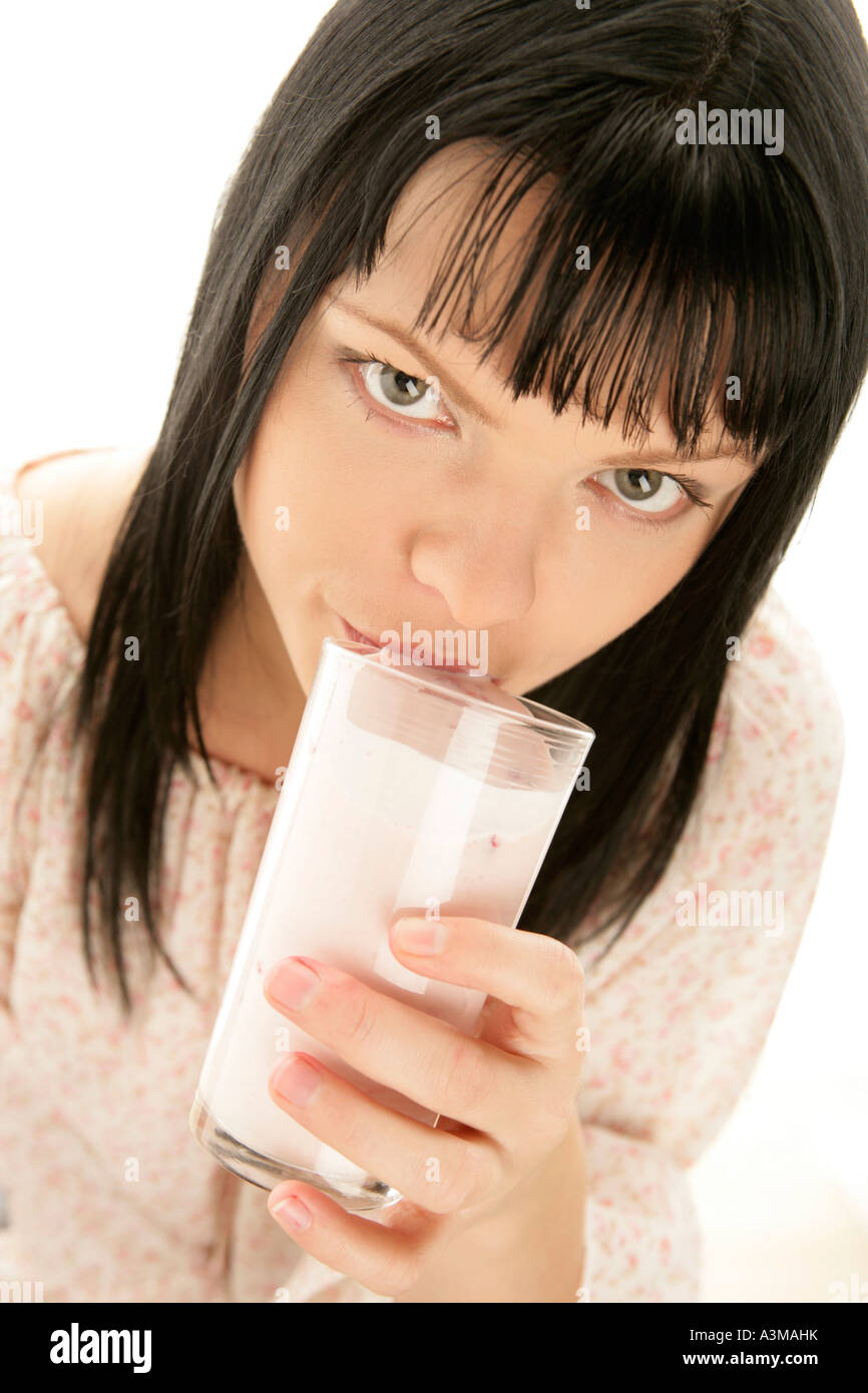 Woman drinking milkshake Stock Photo - Alamy