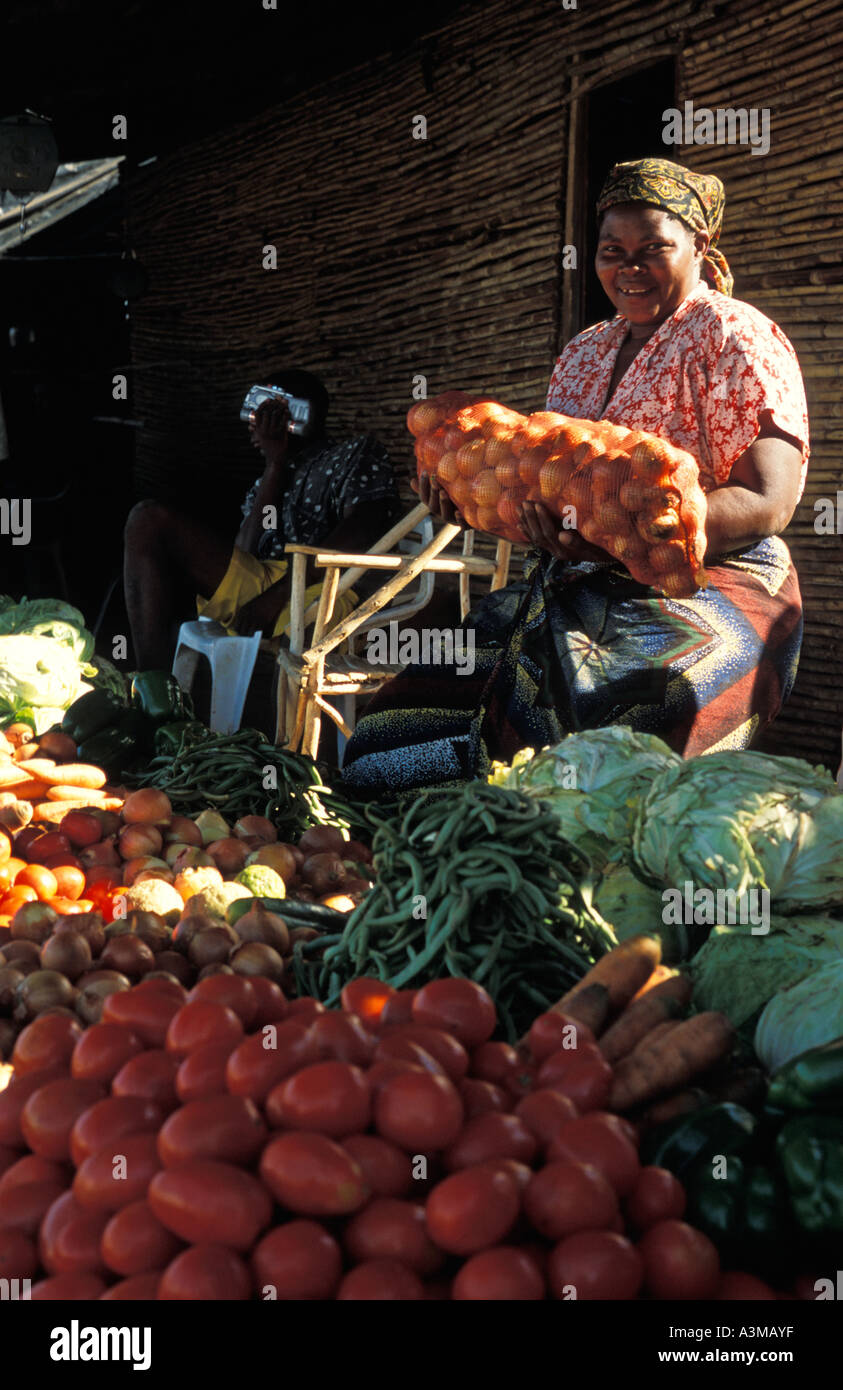 Black African woman selling in a vegetable market in Beira Mozambique ...