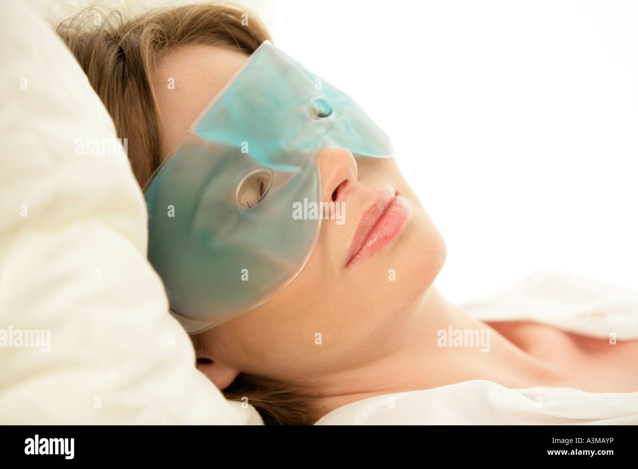 Woman with mask over eyes Stock Photo - Alamy