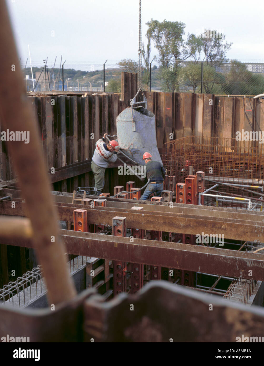 Workmen pouring concrete during hi-res stock photography and images - Alamy