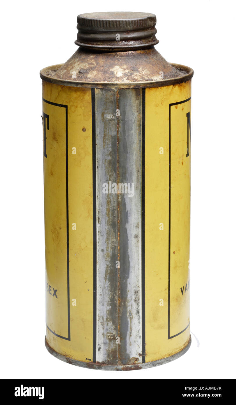 Rusty old yellow tin container Stock Photo - Alamy