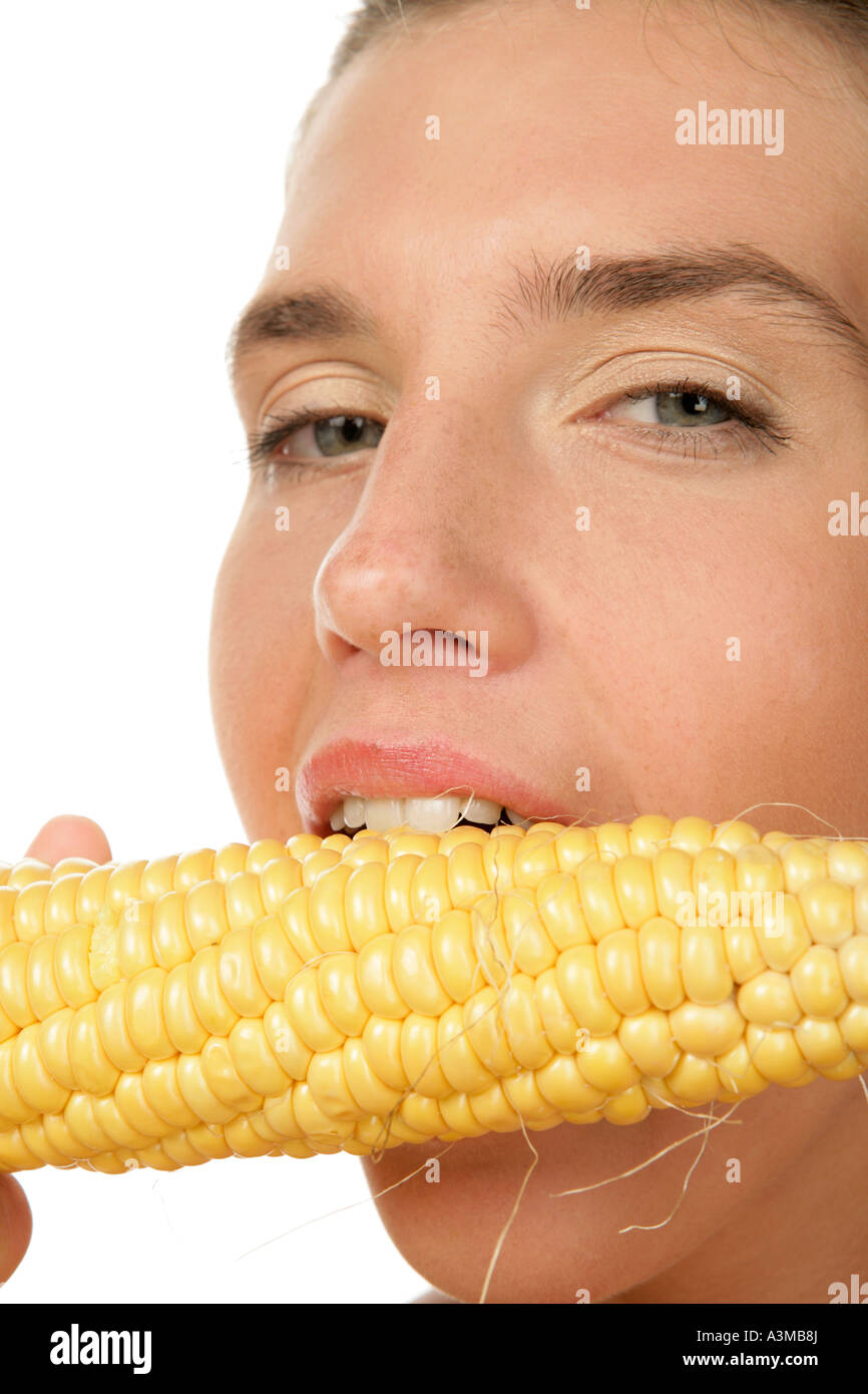 Woman eating corn-cob Stock Photo - Alamy