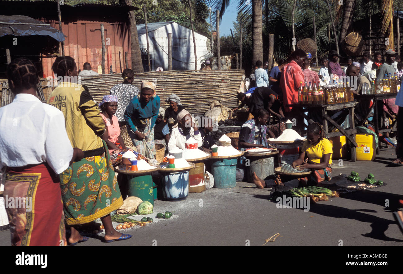 African woman selling salt or flour at an outdoor market in Beira ...