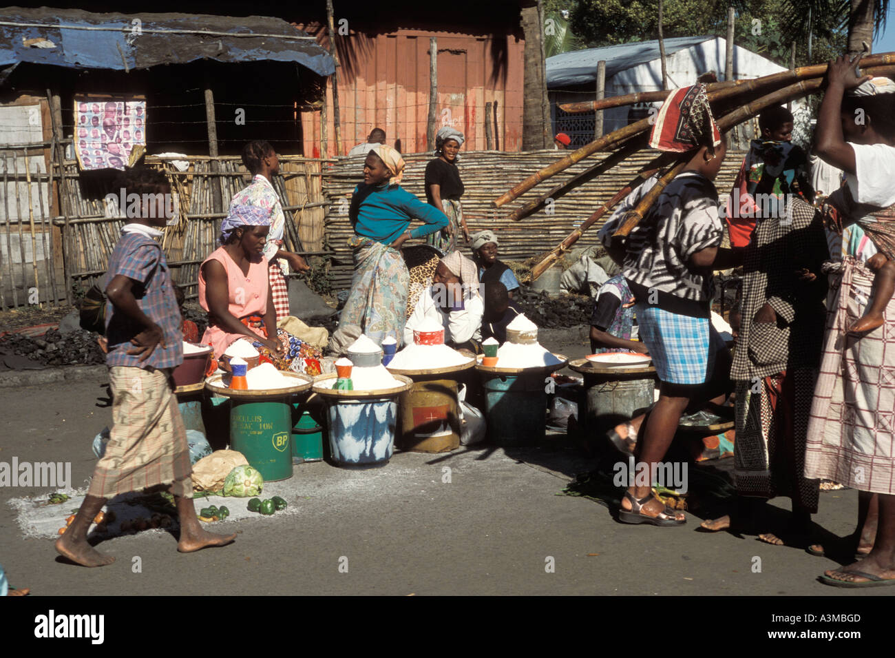 African woman selling salt or flour at an outdoor market in Beira ...