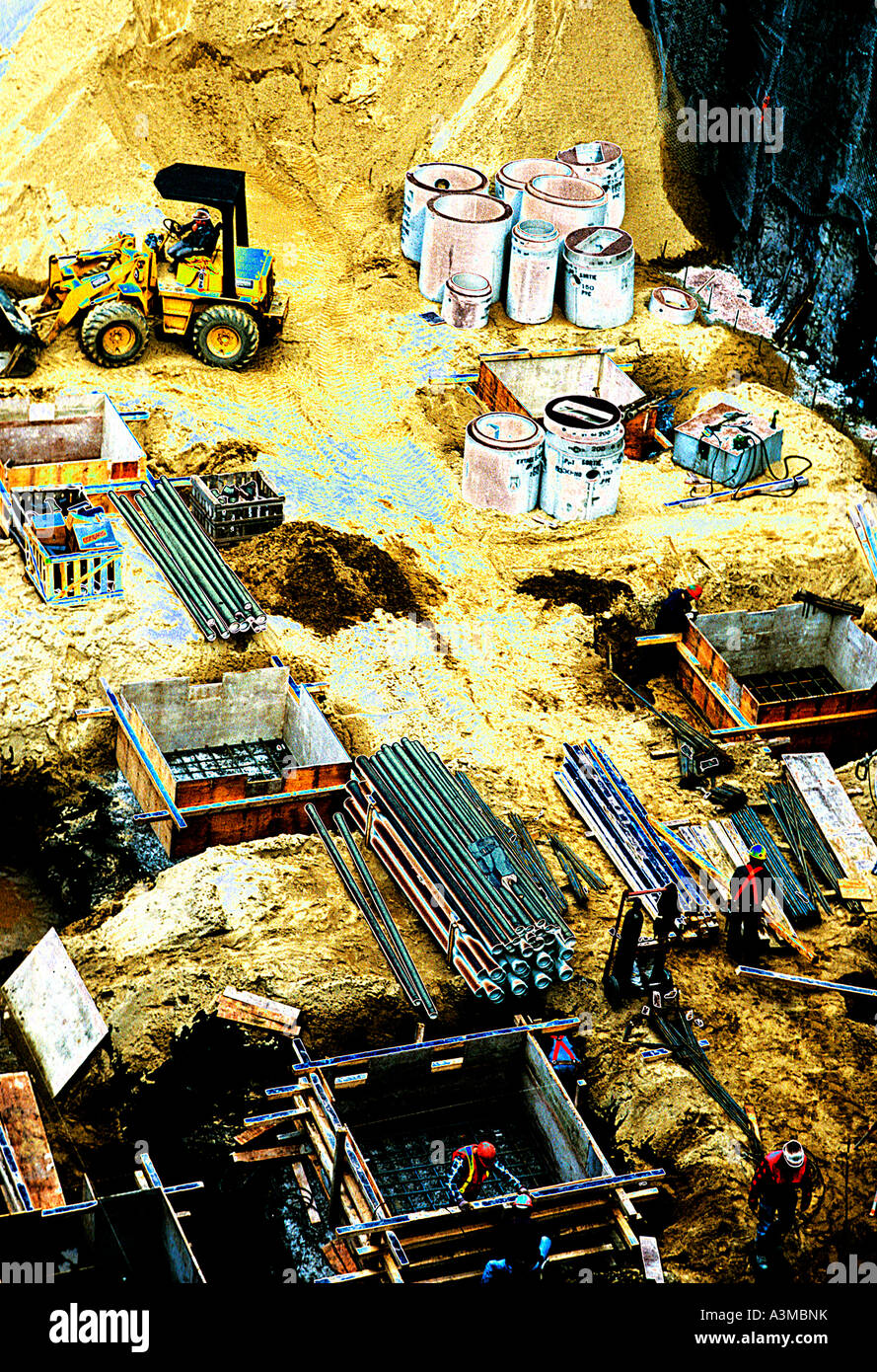 backhoe tractor moves sand gravel around large construction pit Stock ...