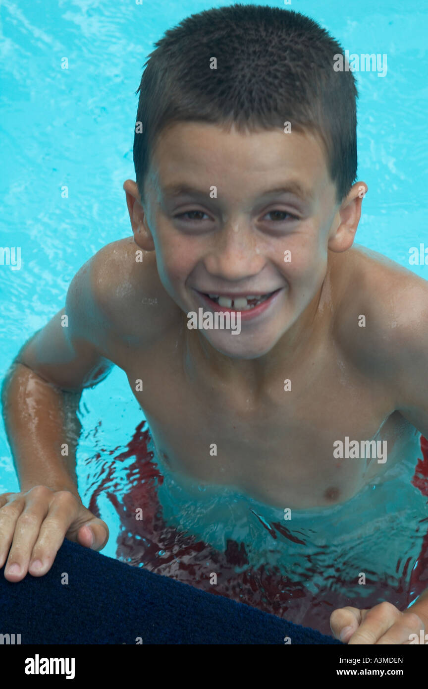 1 one young 8 9 eight nine year old boy enjoys swimming pool happy ...