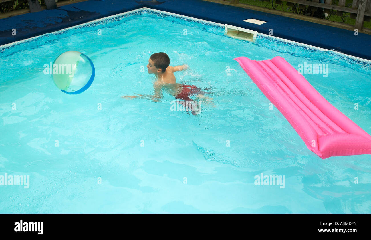 1 one young 8 9 eight nine year old boy enjoys swimming pool Stock ...