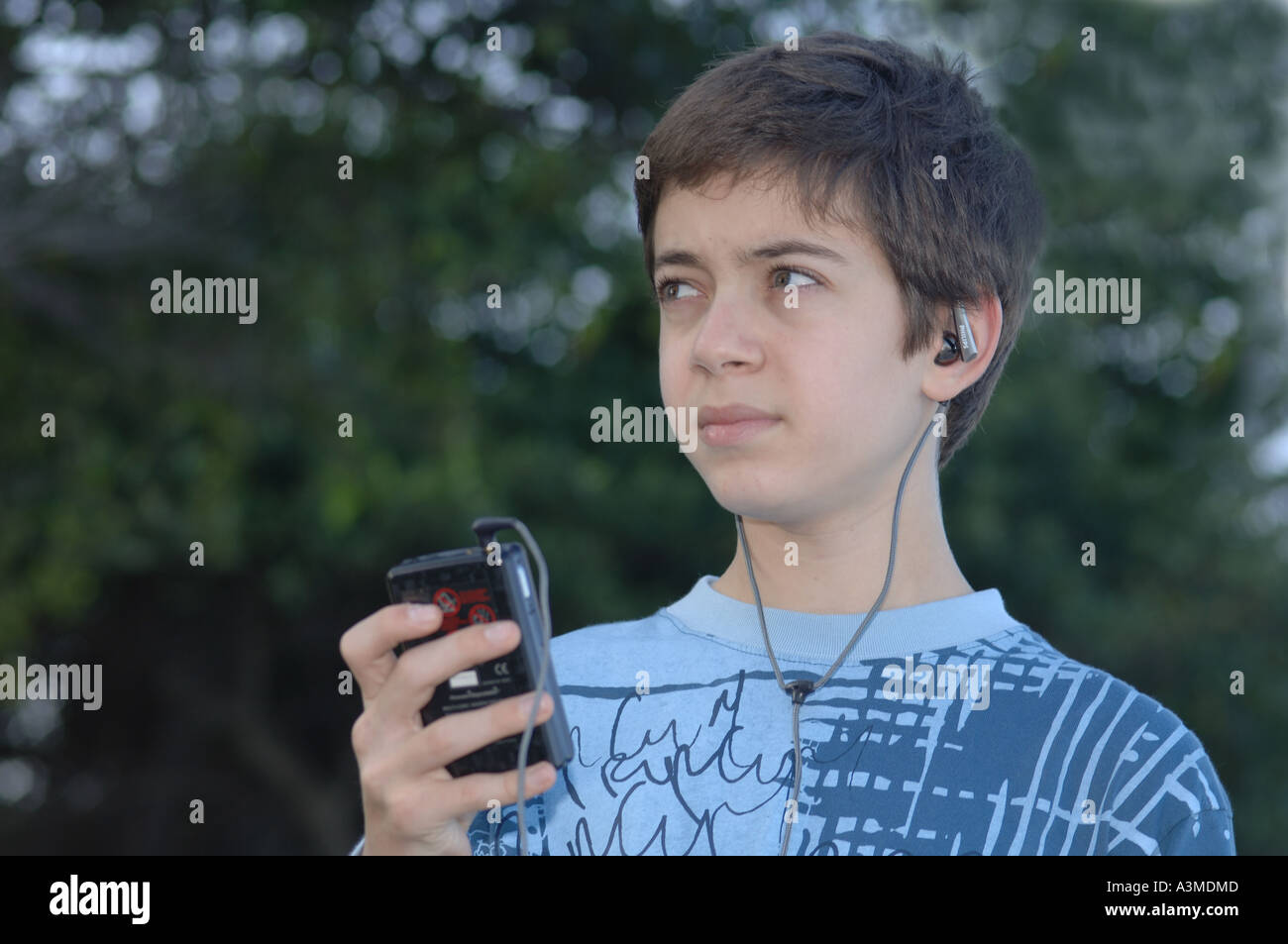 teenager boy with mp3 music player Stock Photo - Alamy
