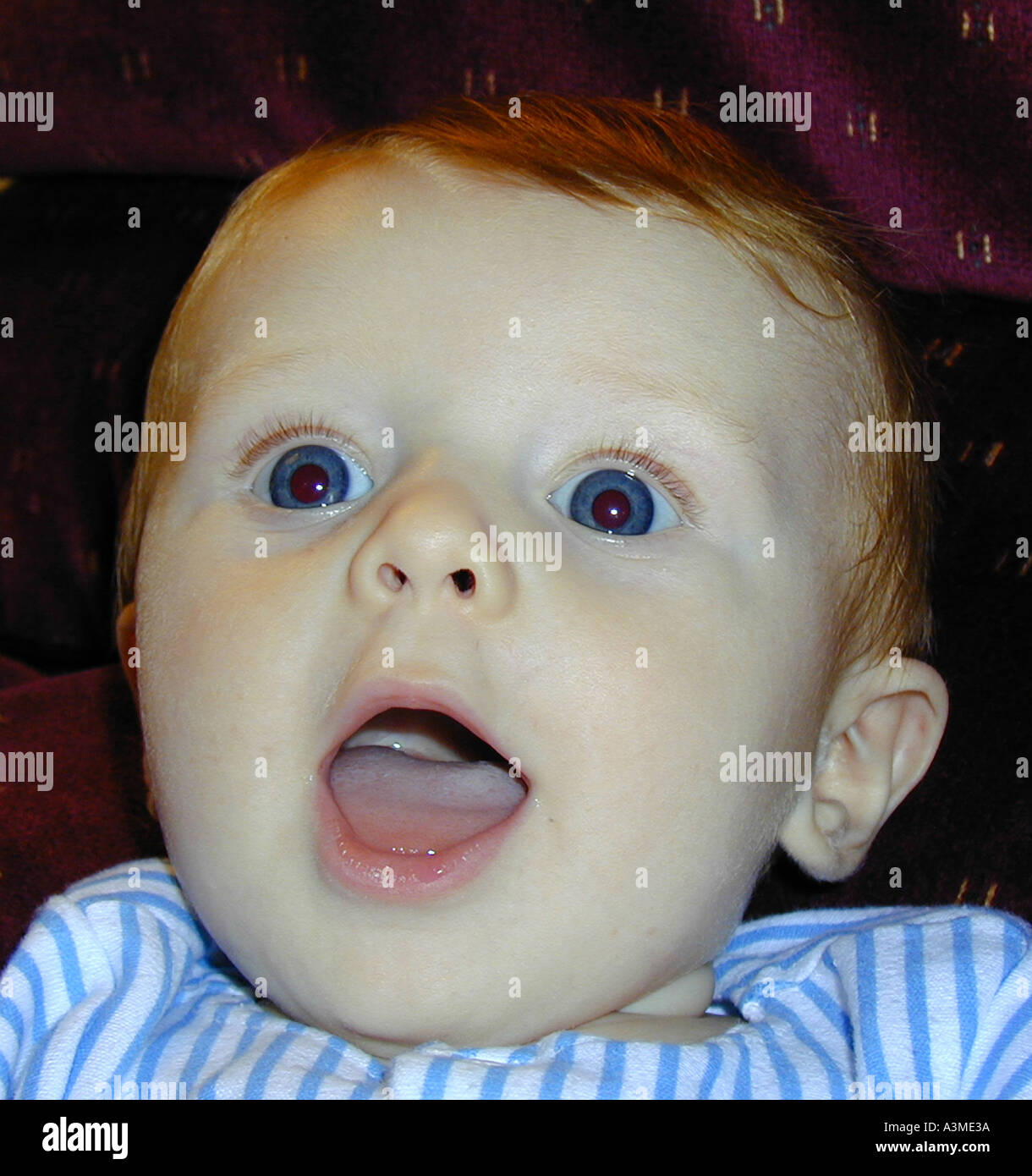 Happy Red headed baby boy smiling with blue eyes Stock Photo - Alamy