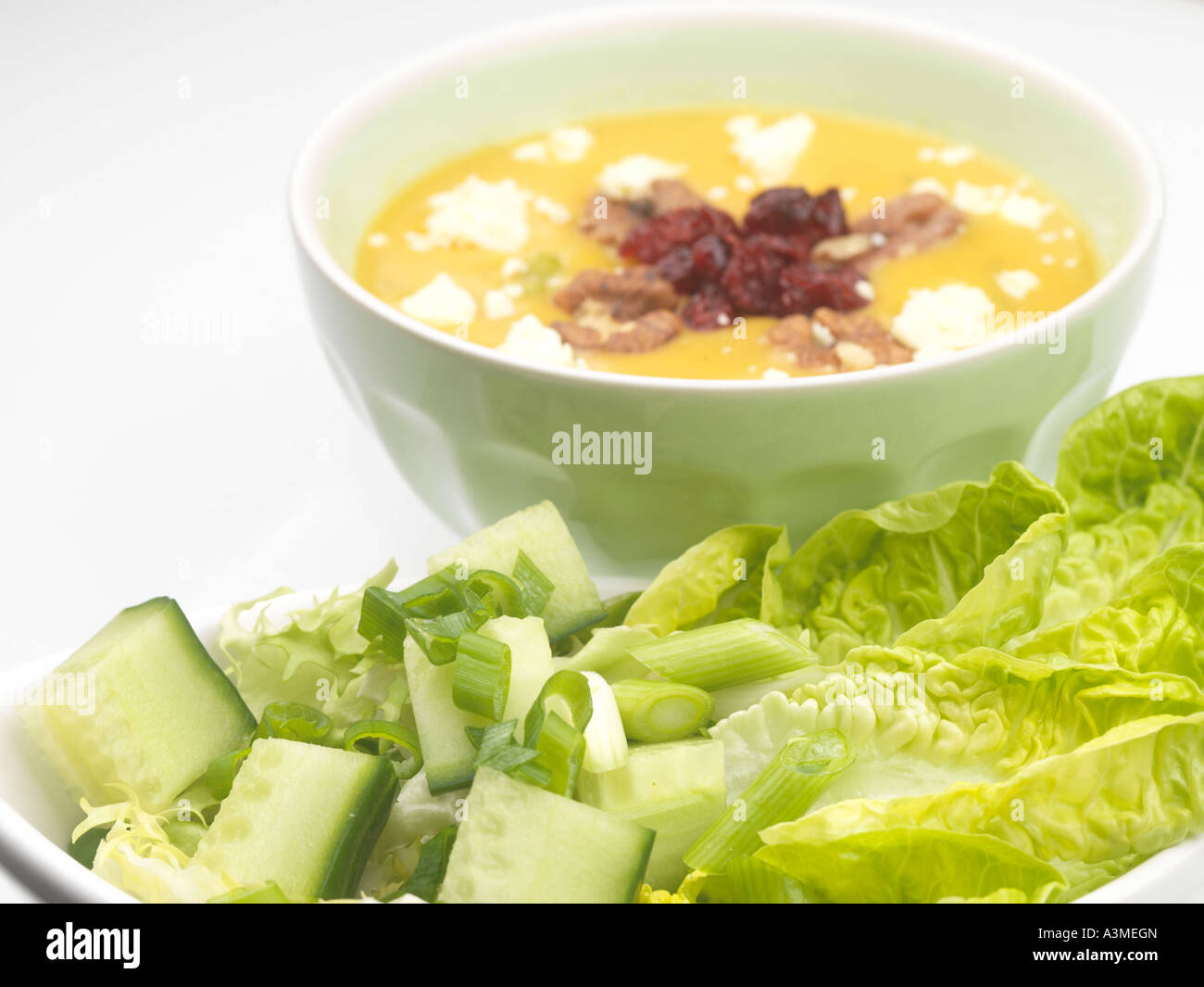 Vegetable Soup with Cranberry and Walnut Garnish Stock Photo - Alamy
