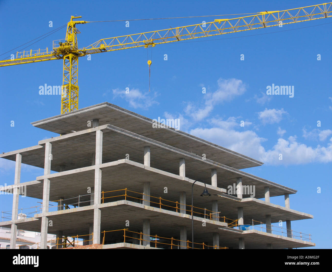 Crane over partially constructed building Stock Photo - Alamy