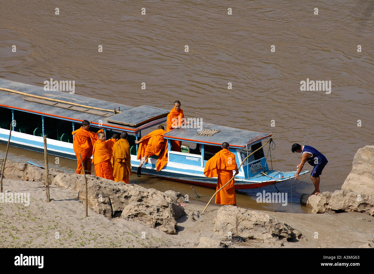 Lao Monks Boarding Ship in Port of Louangphrabang on Mekong River Laos ...