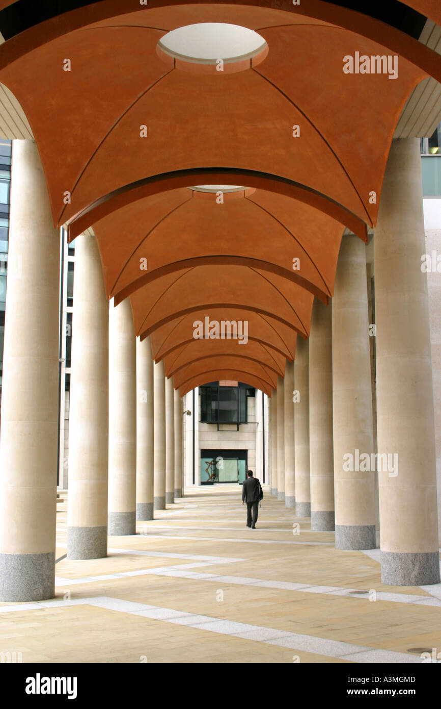 Man walking through covered walkway, London Stock Photo - Alamy