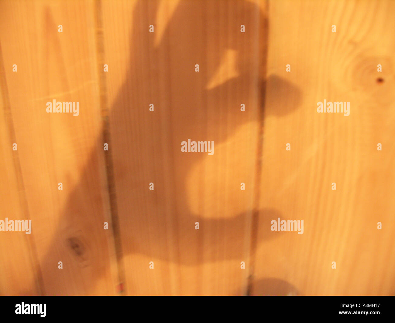 hand making a shadow against wooden background Stock Photo - Alamy