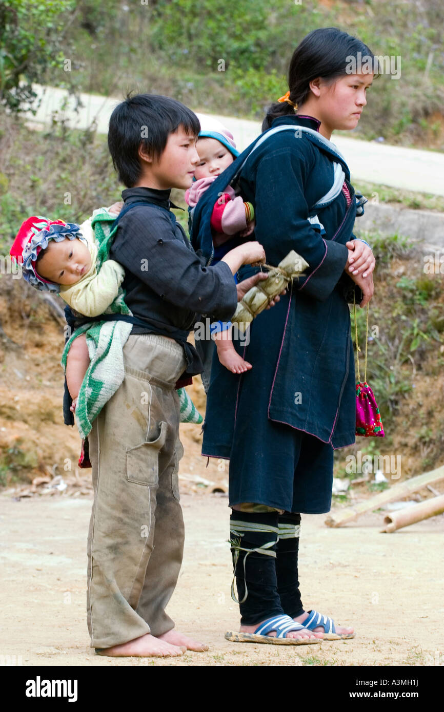 Young boy Hmong carry his sister of the Sapa area Stock Photo - Alamy