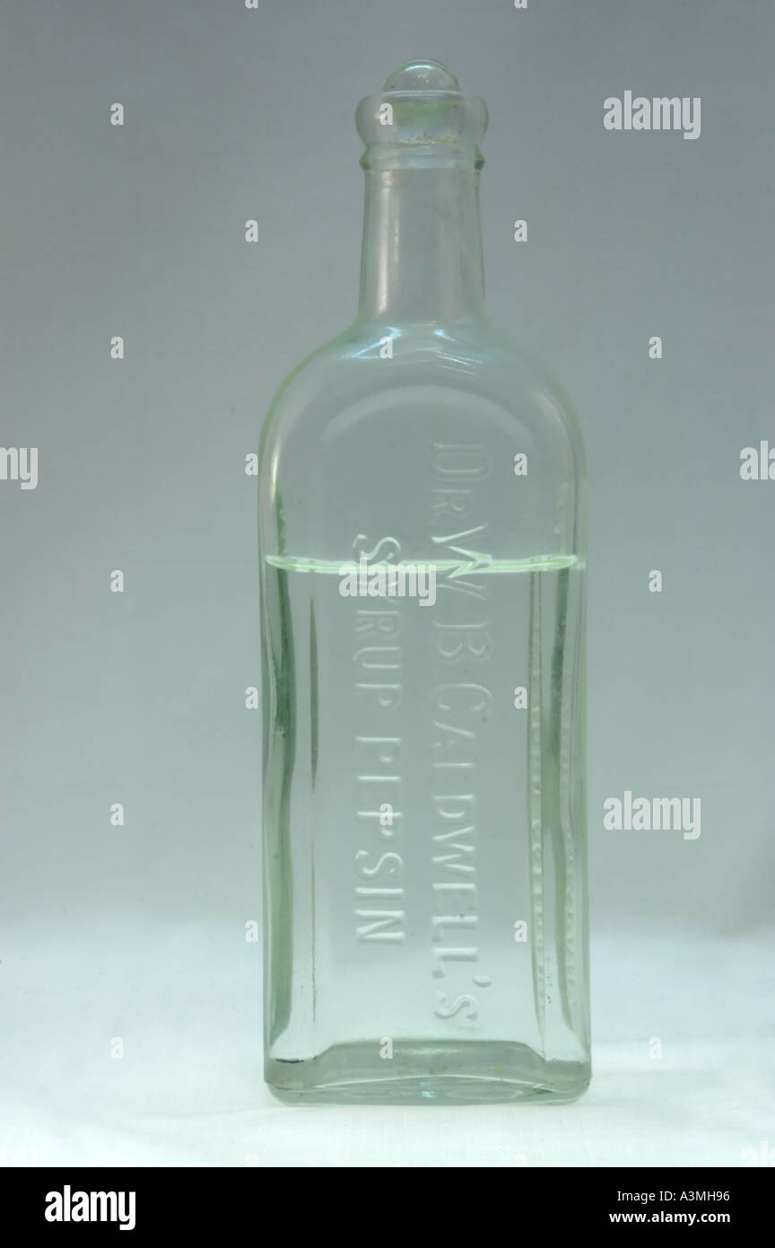Antique glass bottle partially filled with a clear liquid Stock Photo ...