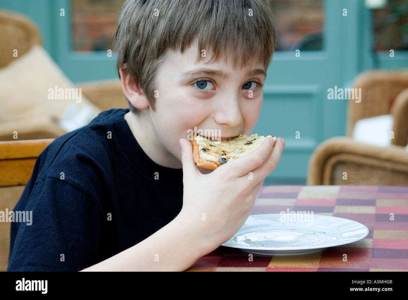 boy eating fruit bun Stock Photo - Alamy