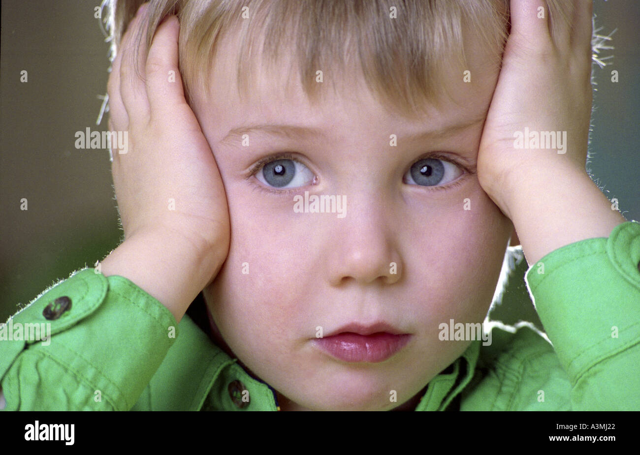 A five year old boy looking anxious Stock Photo - Alamy