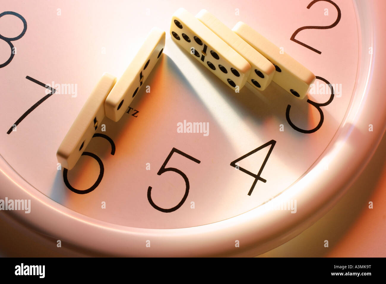 Dominoes on Clock Stock Photo - Alamy