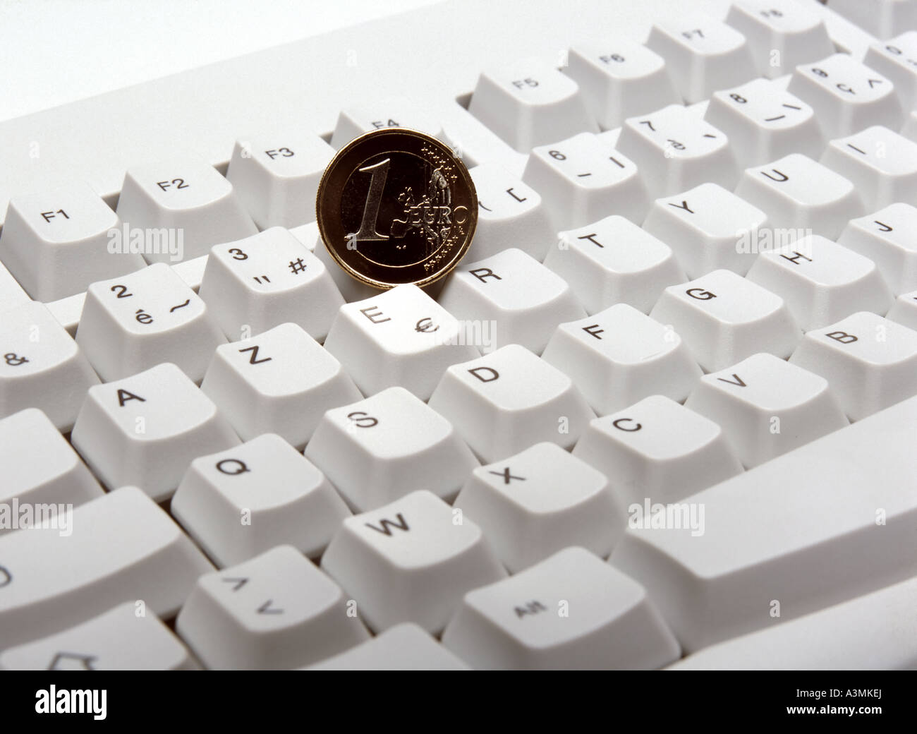 1 EURO COIN ON COMPUTER'S KEYBOARD Stock Photo - Alamy