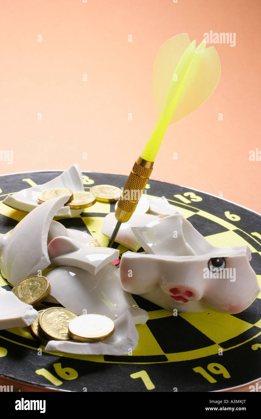 Dart and Broken Piggybank on Dartboard Stock Photo - Alamy