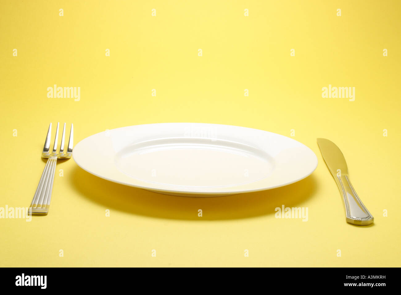 Plate with Fork and Knife Stock Photo - Alamy
