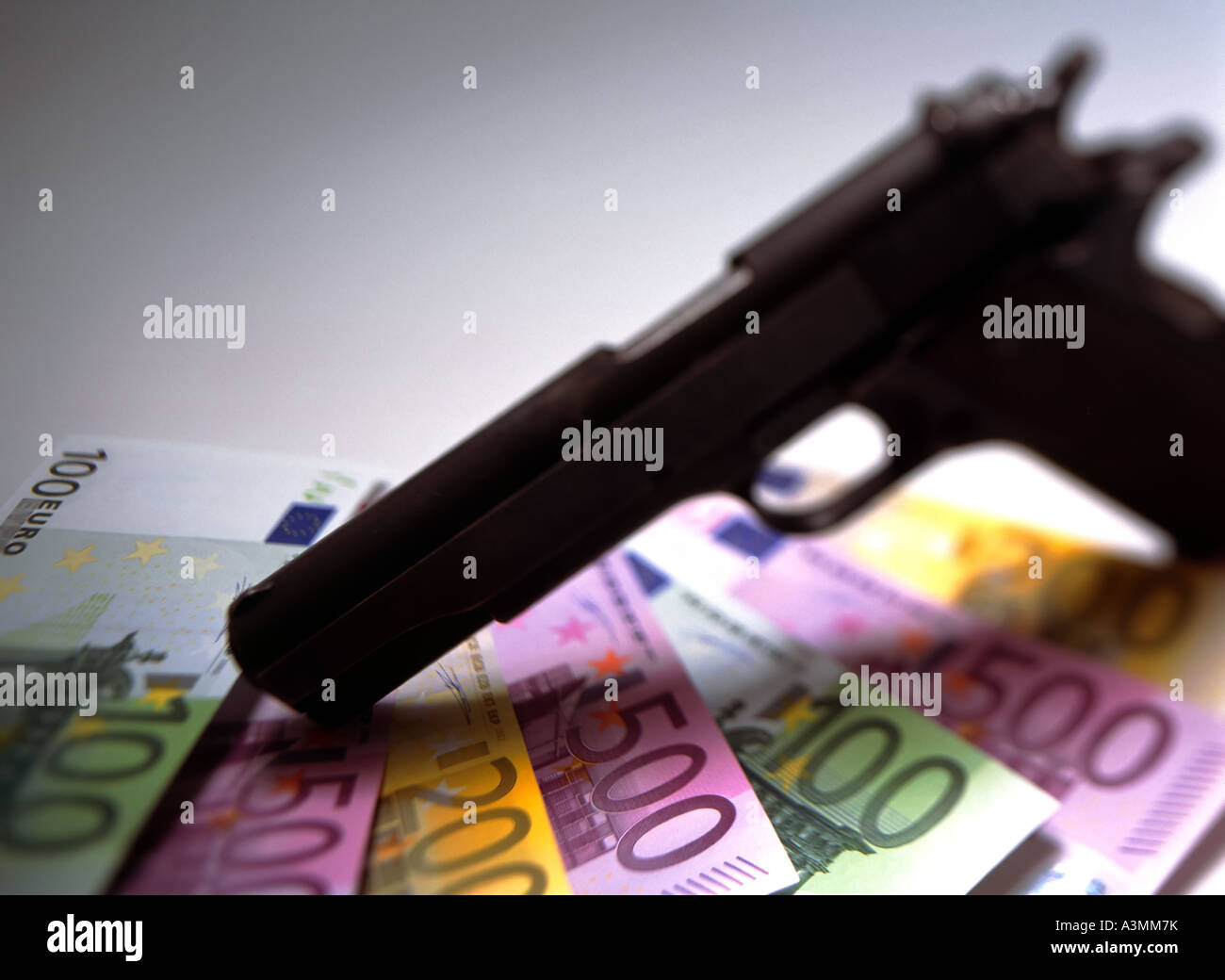 SILHOUETTE OF A COLT 45 PISTOL GUN ON EURO BANKNOTES Stock Photo - Alamy