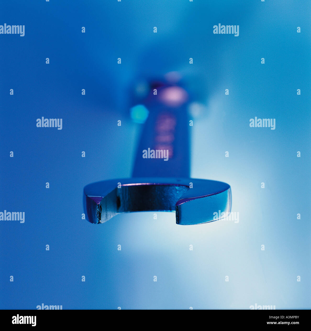 wrench isolated in blue light Stock Photo - Alamy