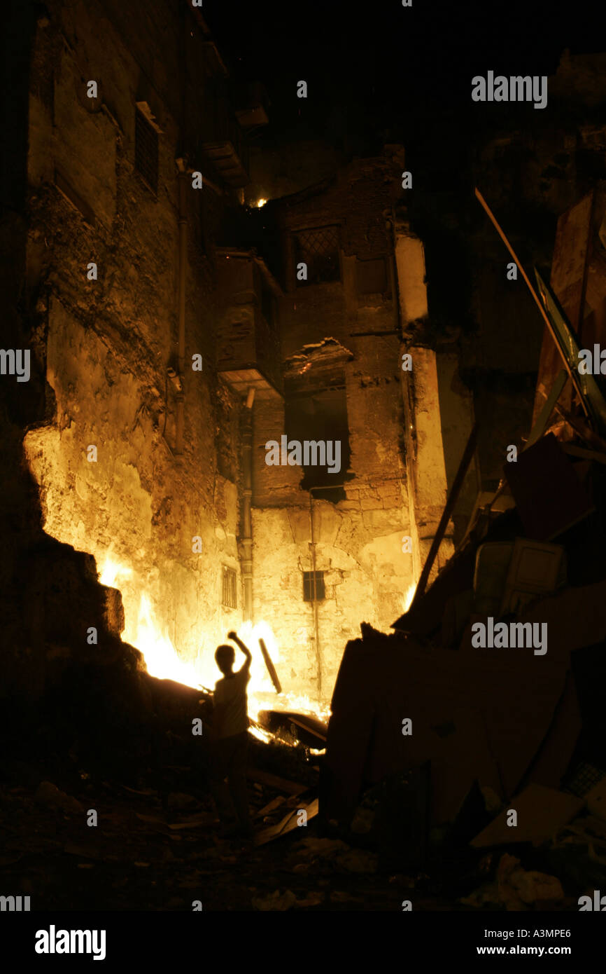 Local boy trowing wooden object to the fire vucciria palermo sicily ...