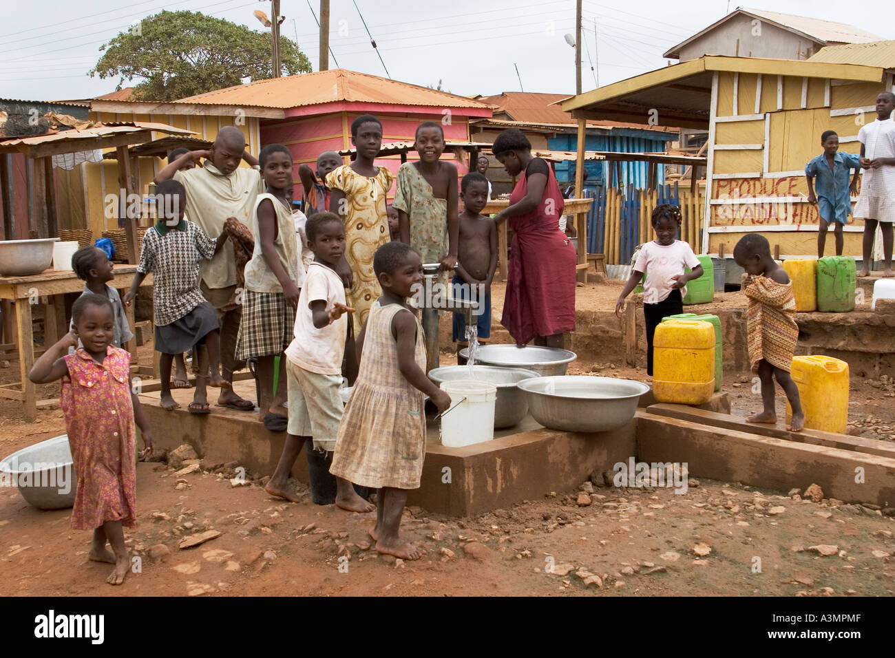 Village people pumping potable water in the village centre Ghana West ...
