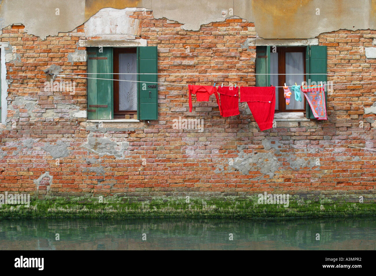 Venice Italy everyday scene washing line along side canal in Castello ...