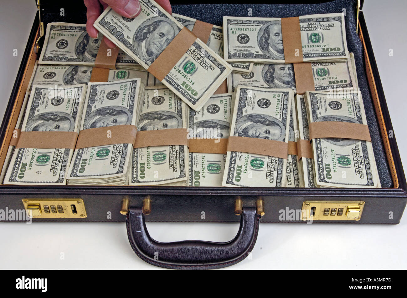 brief case full of 100 bills US Stock Photo - Alamy