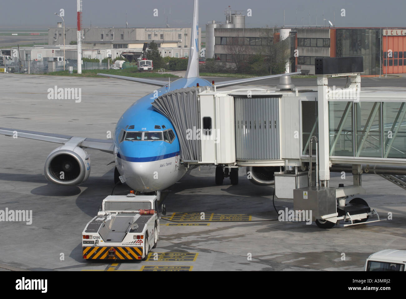 KLM Boeing 737 at departure gate with air stair pier arm Stock Photo ...