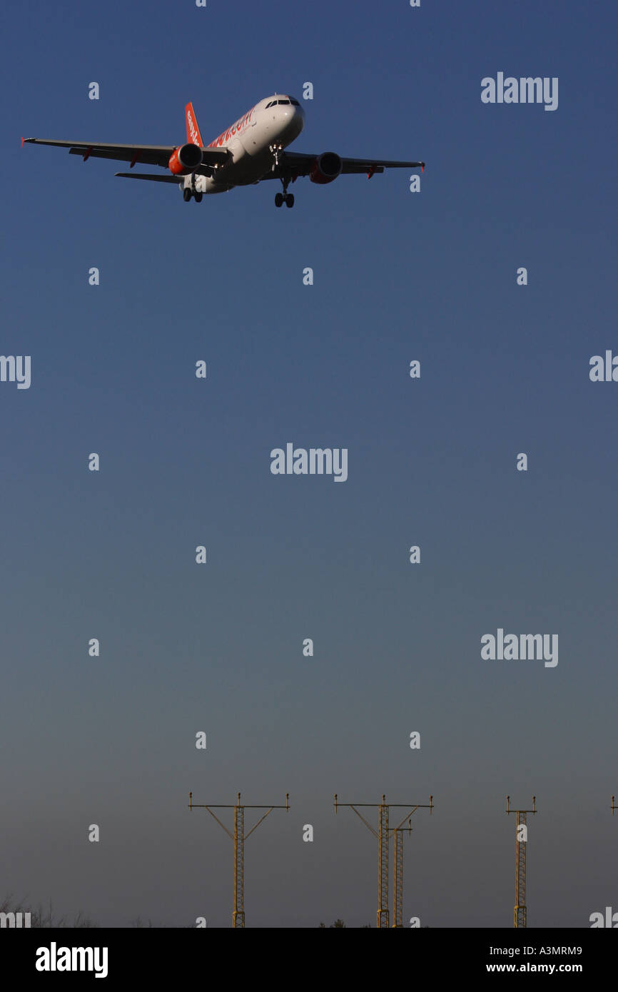 Easyjet Airbus A319 on final approach to land over runway lights Stock ...