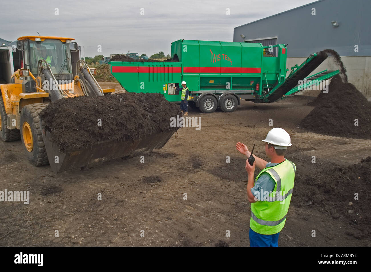 Commercial composting plant operation. Screening compost before storage ...