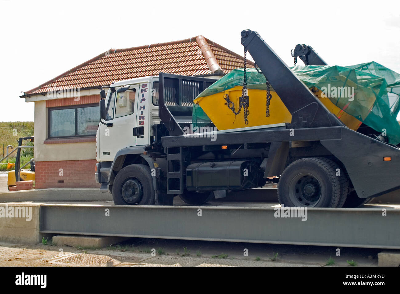 Building skip on weighbridge correctly sheeted up to prevent bulk ...