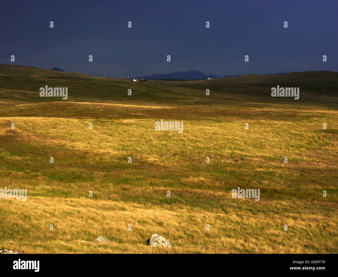 Sun and dark clouds on white cottages Sutherland Western Highlands of ...