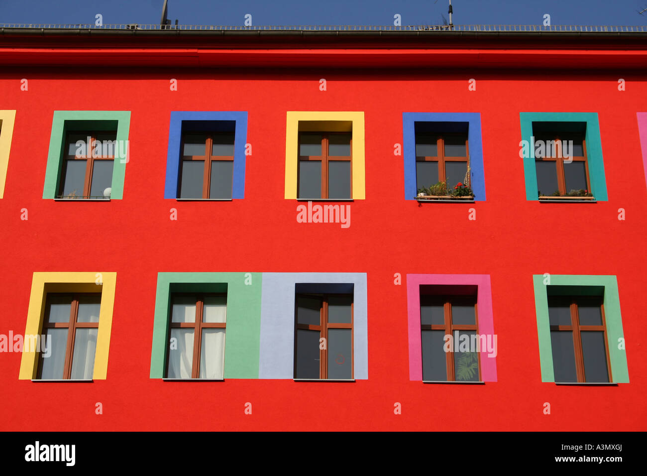 row of colourful windows Stock Photo - Alamy