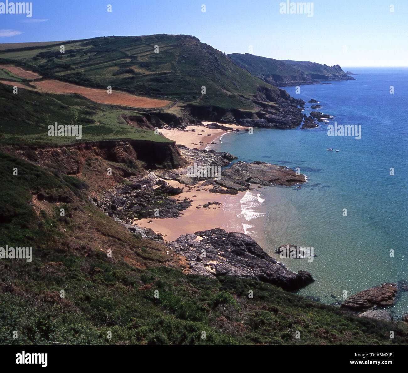Secluded sandy beaches below Gara Rock on the South Devon coast Stock ...