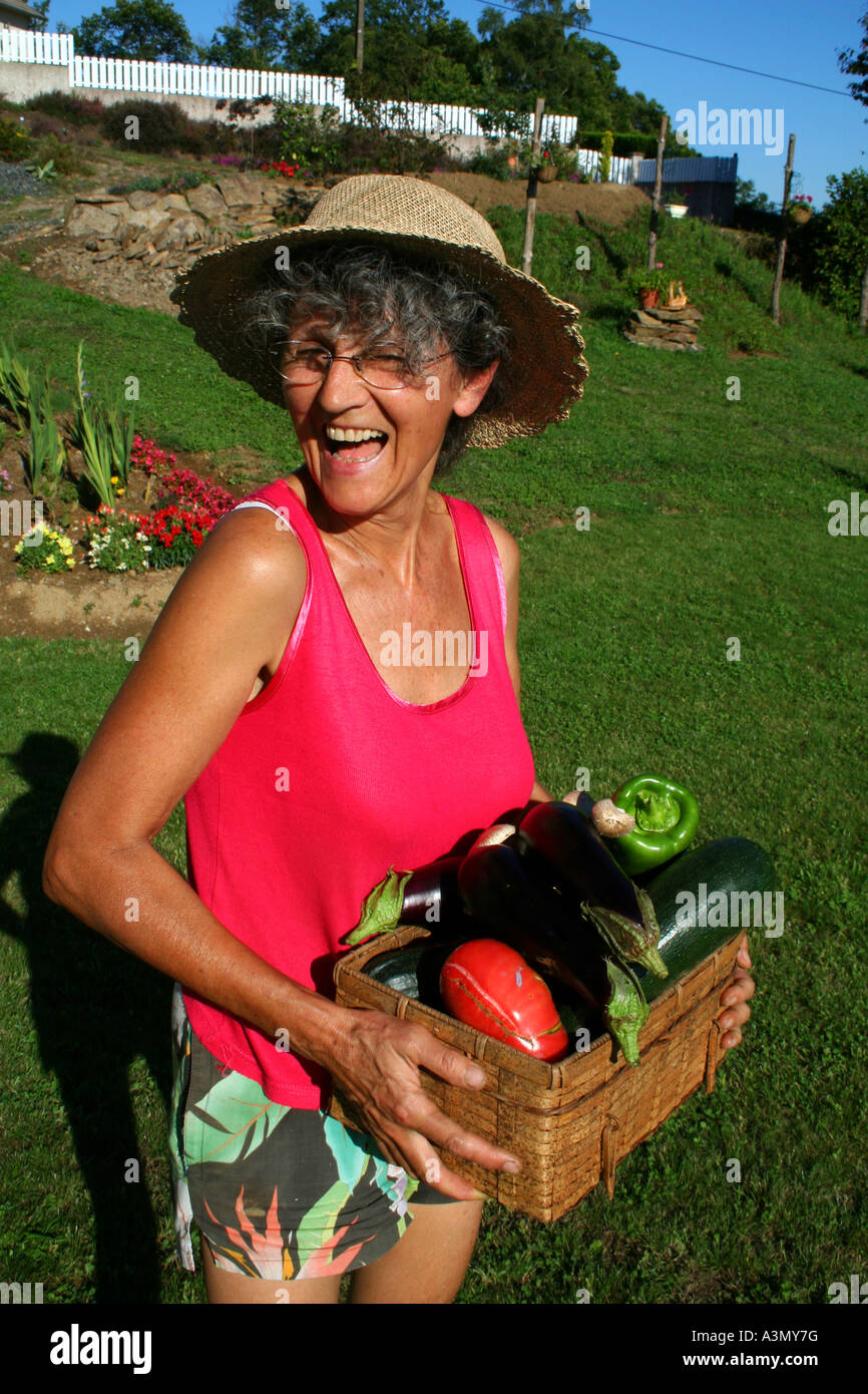 woman laughing with veggie basket Stock Photo - Alamy