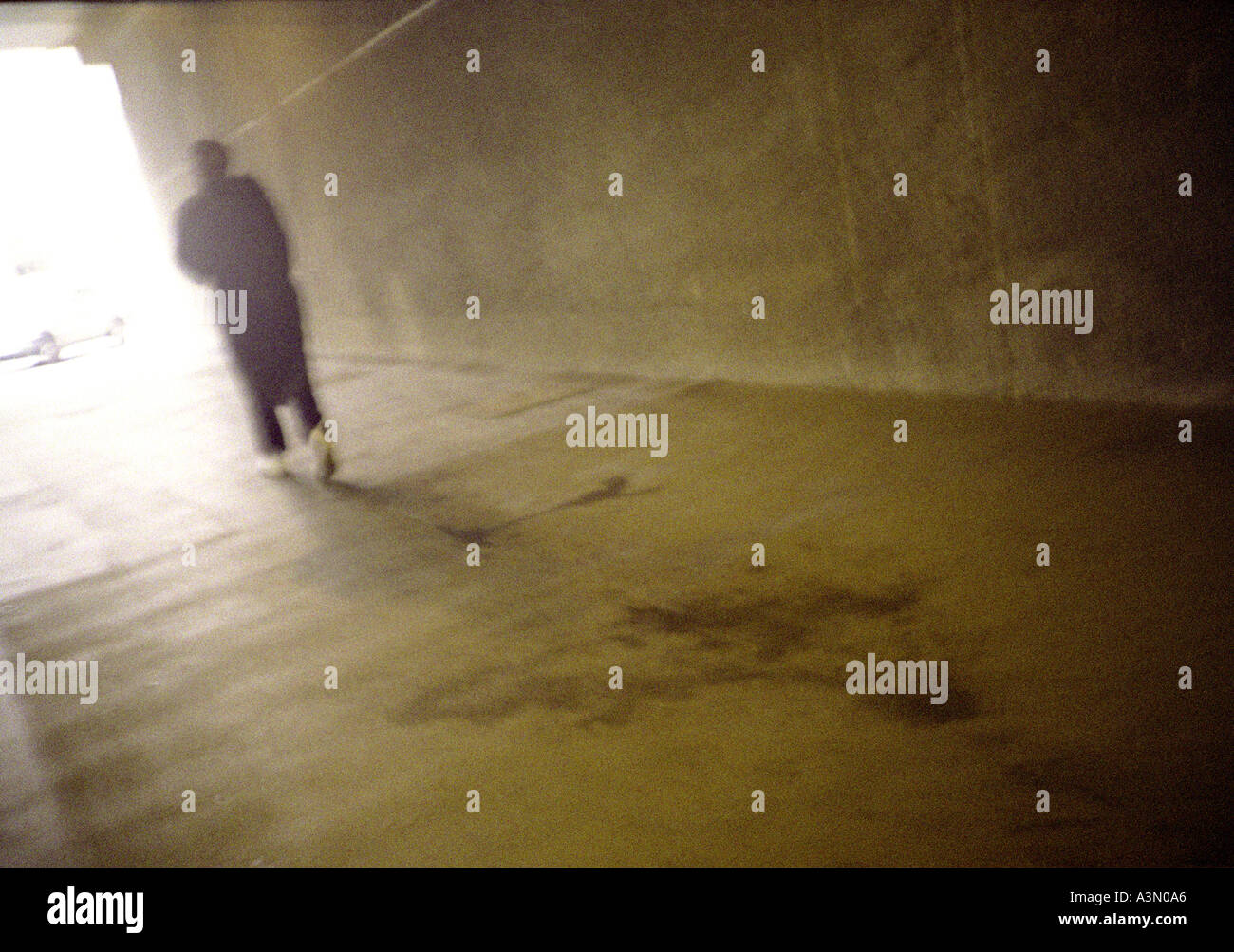 Blurry man walking 3 Stock Photo - Alamy